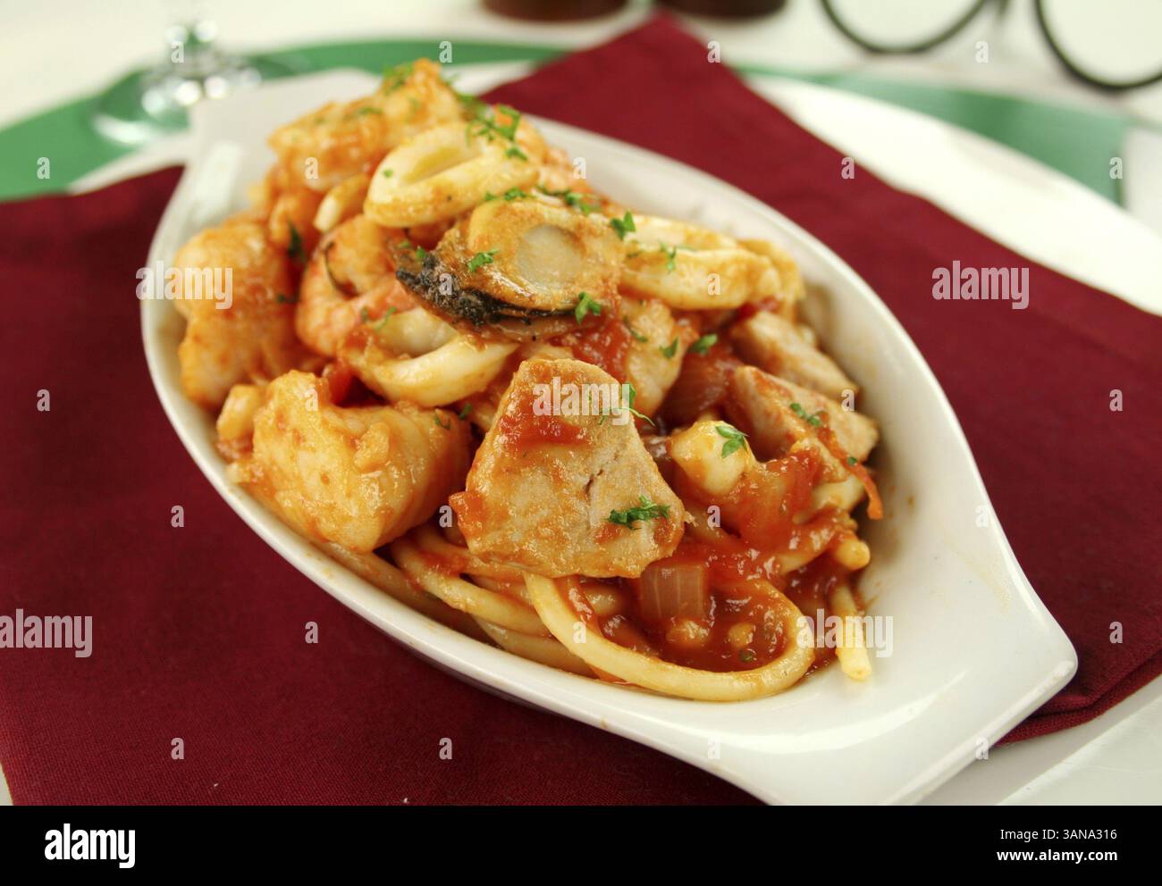 Delicious spaghetti marinara with fish, shrimps, calamari and mussels ...