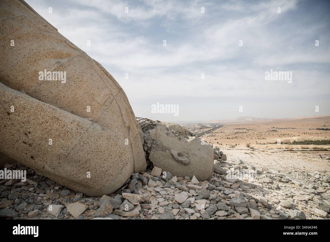 A toppled statue of former Syrian dictator Hafez al-Assad is seen at ...