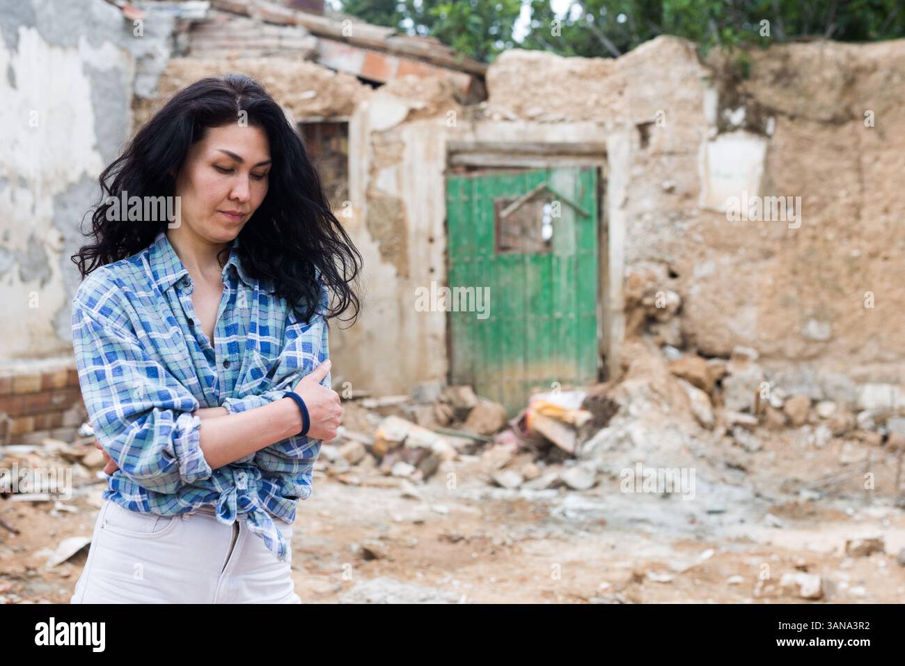 Woman near ruined house hi-res stock photography and images - Alamy