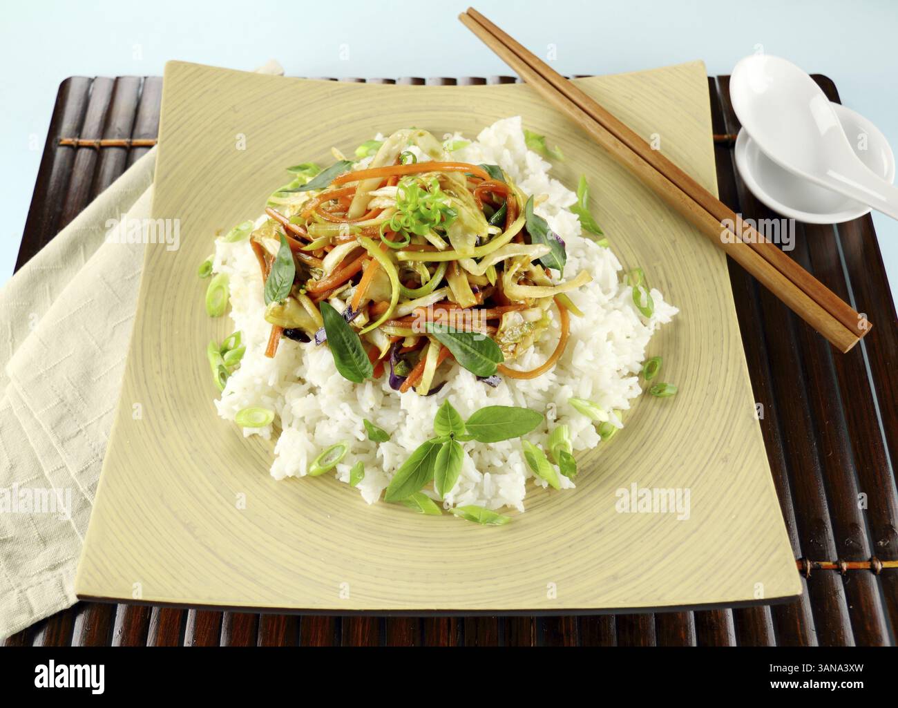 Delicious vegetarian asian stir fry on boiled white rice with thai ...