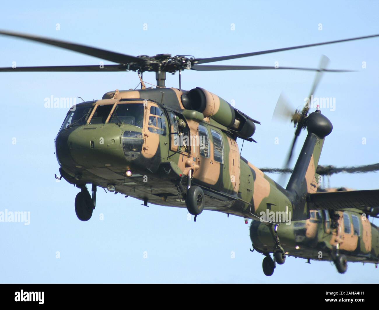 Blackhawk helicopter in flight close hi-res stock photography and ...