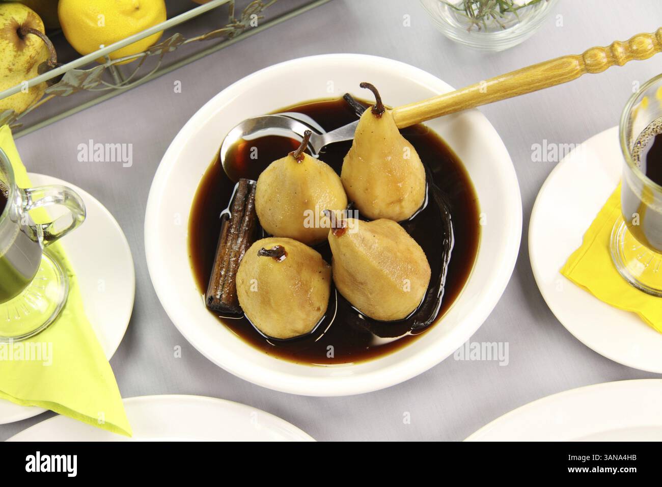Delicious poached pears in chocolate syrup ready to serve Stock Photo ...