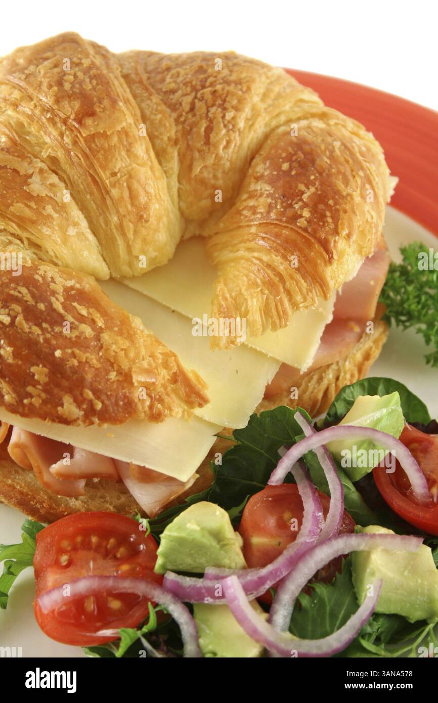 Delicious ham and cheddar cheese croissant with salad Stock Photo - Alamy