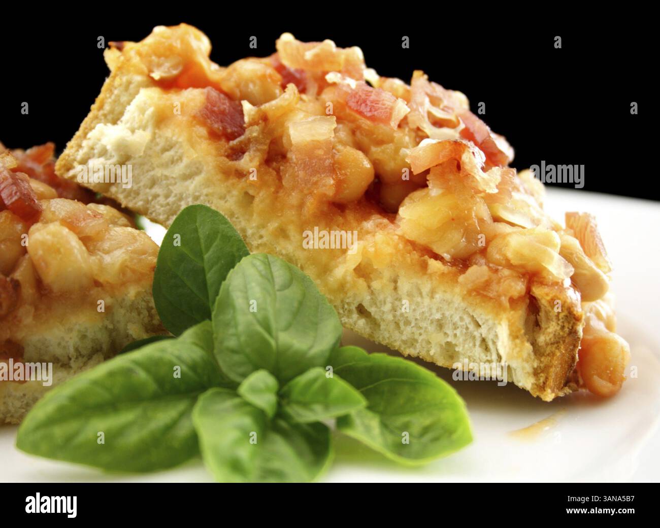 Delicious diced bacon with baked beans on sour dough bread Stock Photo ...