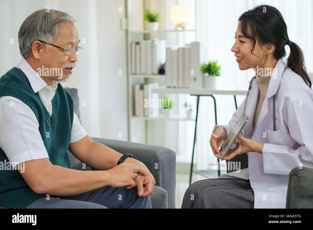 Doctor Explaining Healthy Eating and Food Pyramid to Senior Patient ...