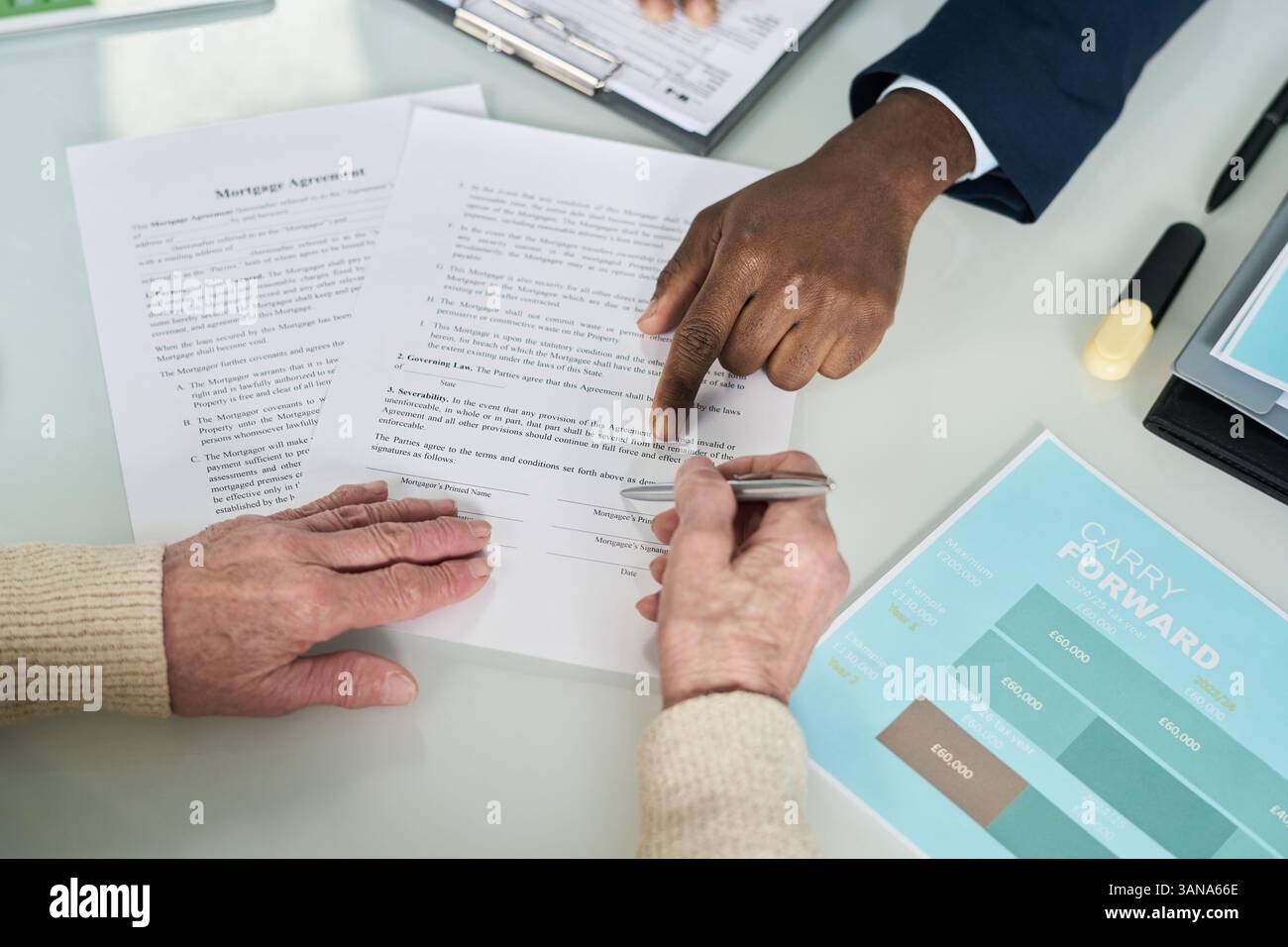 Old woman signing agreement hi-res stock photography and images - Alamy