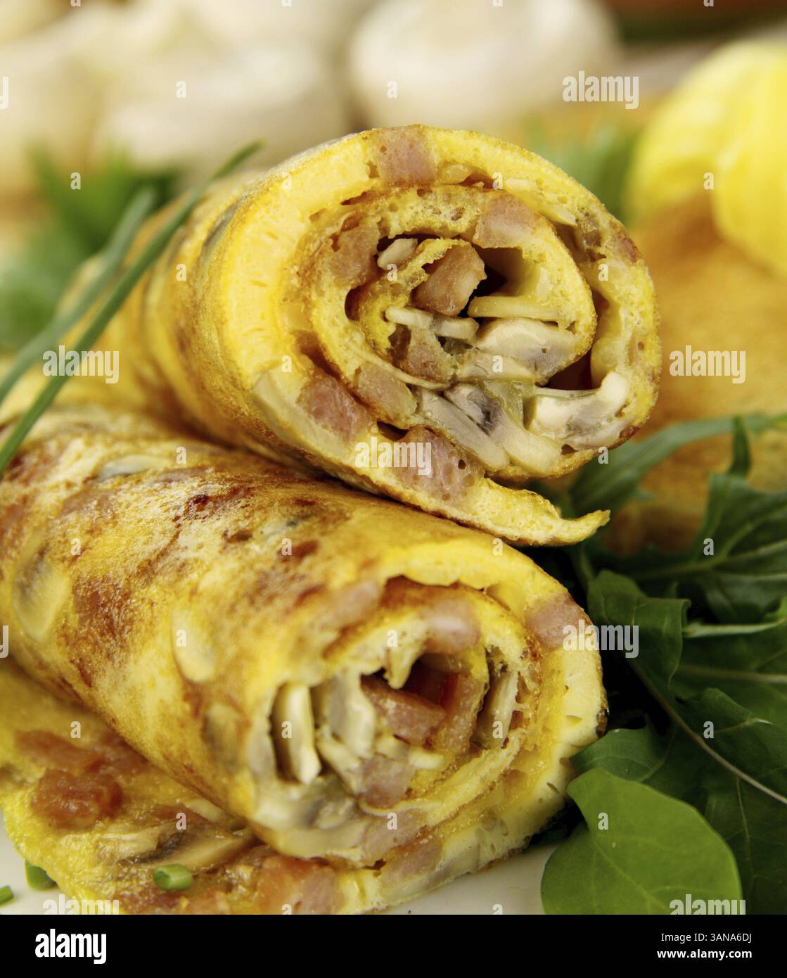 Delicious rolled mushroom and bacon omelette freshly prepared and ready ...