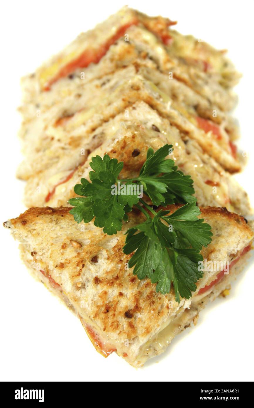 Toasted cheese and tomato sandwiches cut into quarters Stock Photo - Alamy