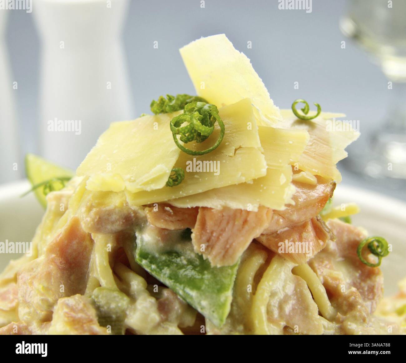 Delicious parmesan cheese on top of creamy salmon spaghetti Stock Photo ...