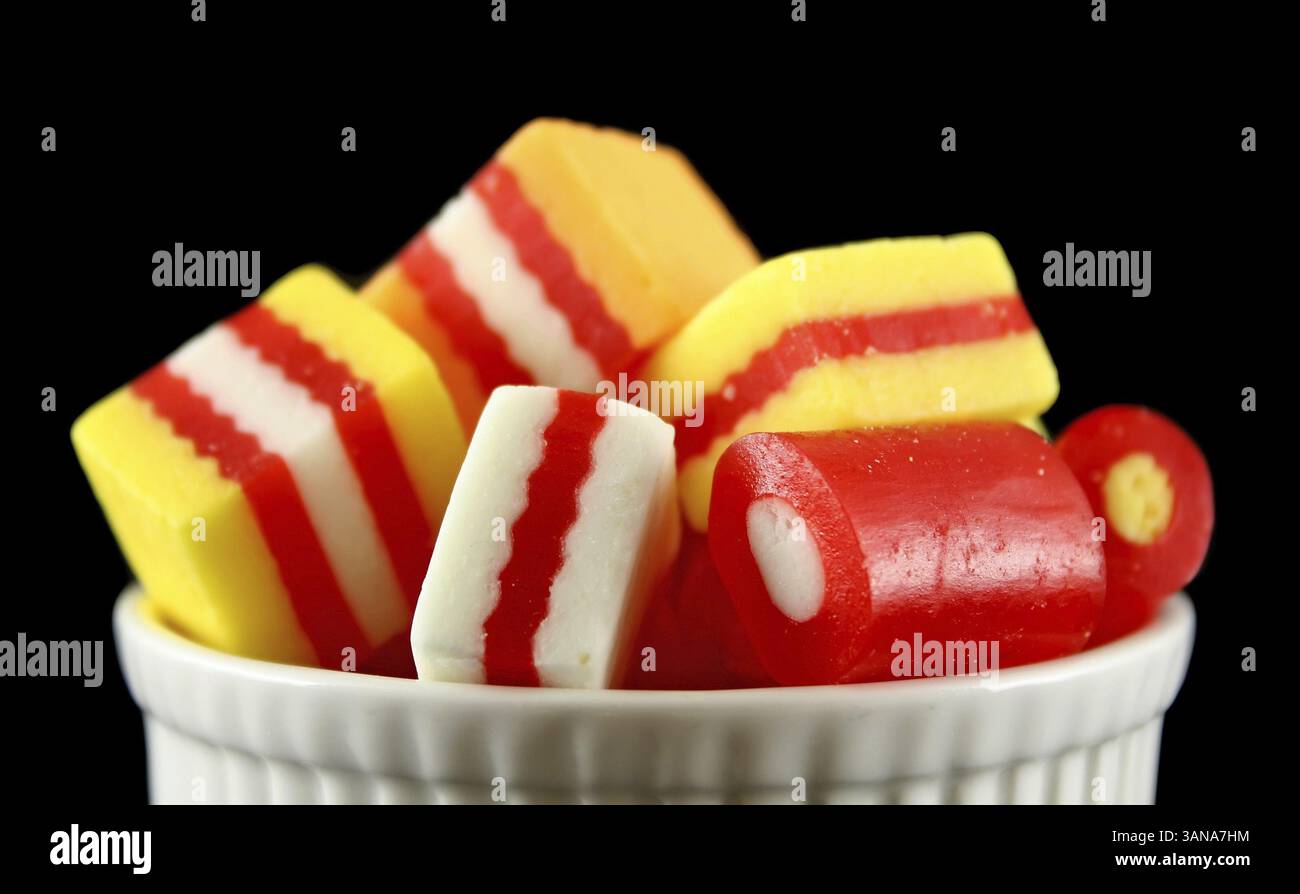 Colorful striped fruit flavored candies in a bowl Stock Photo - Alamy