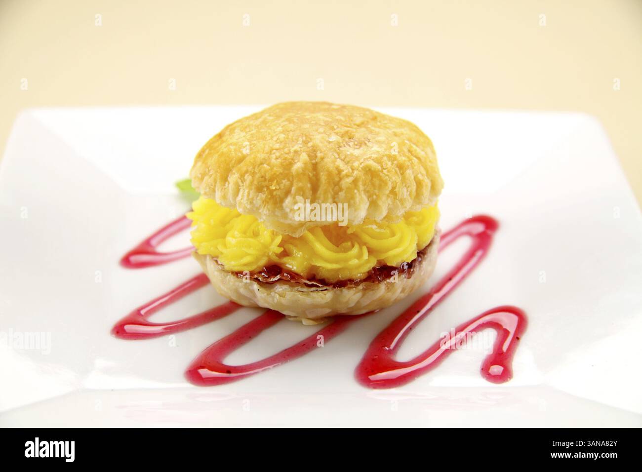 Delightful crisp custard and raspberry pastry cakes ready to serve ...