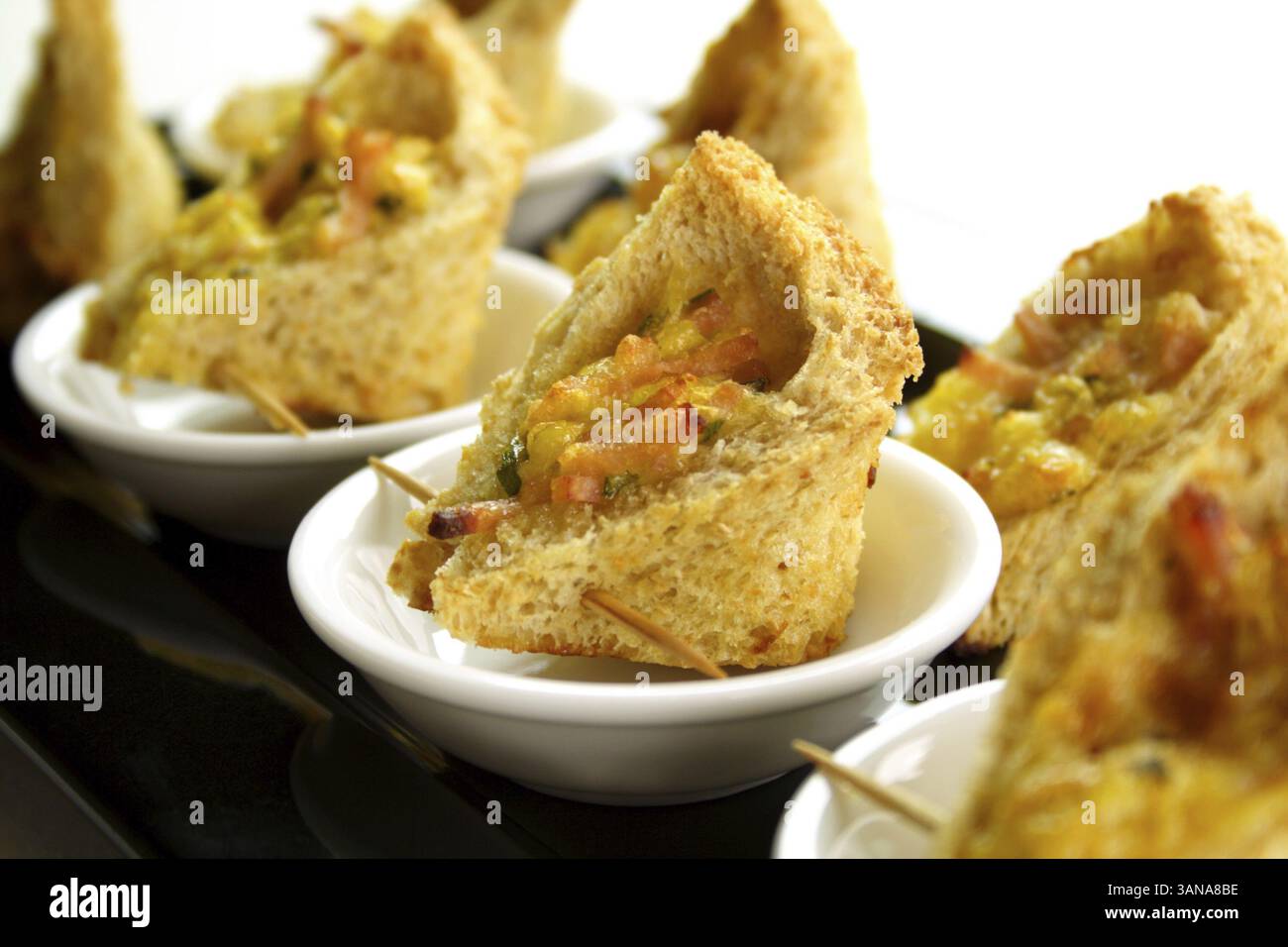 Baked triangles made with corn, ham and cheese with wholemeal bread ...