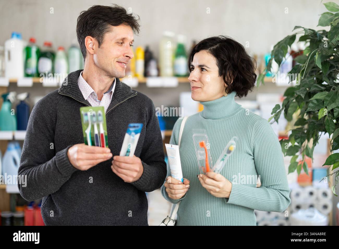 Married couple chooses toothbrush in supermarket Stock Photo - Alamy
