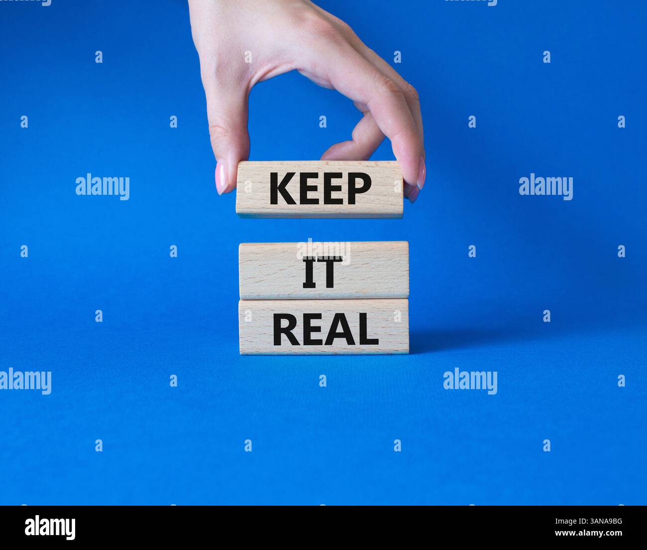 Keep it real symbol. Concept word Keep it real on wooden blocks ...
