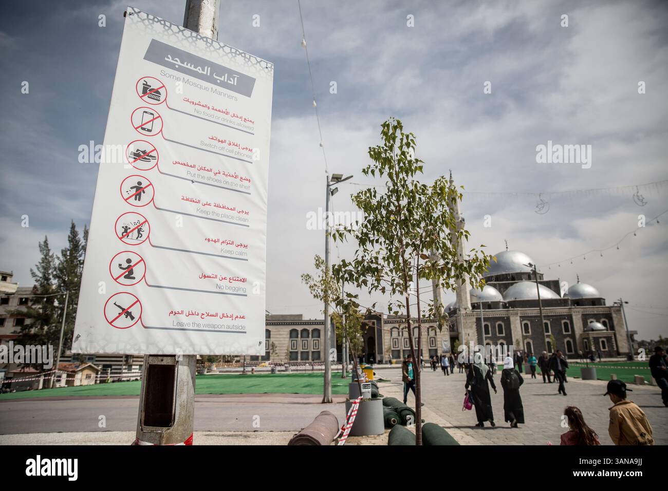 Homs, Syria. 25th Mar, 2025. A poster of "mosque manners" outside the ...