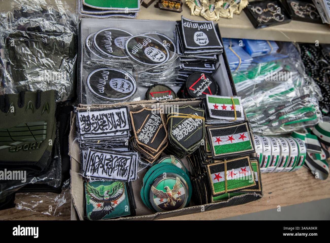 Patches, including the Syrian revolutionary flag and one associated ...
