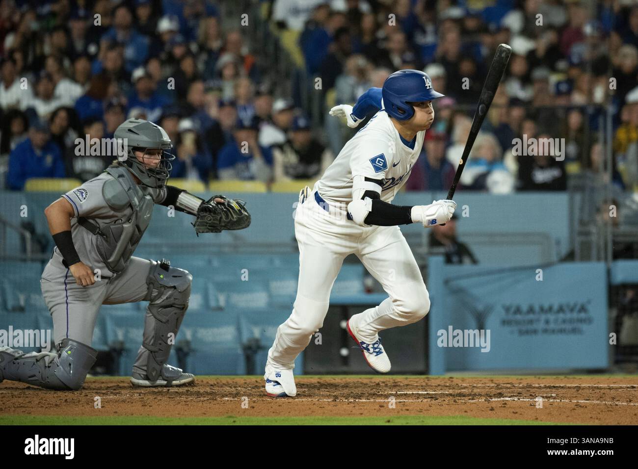 Los Angeles Dodgers' Shohei Ohtani hits an infield single during the ...
