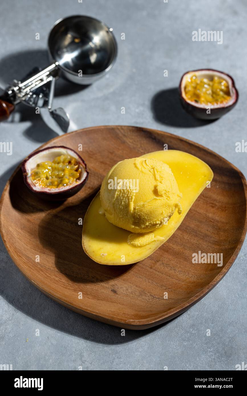 Mango and passion fruit ice cream ball Stock Photo - Alamy