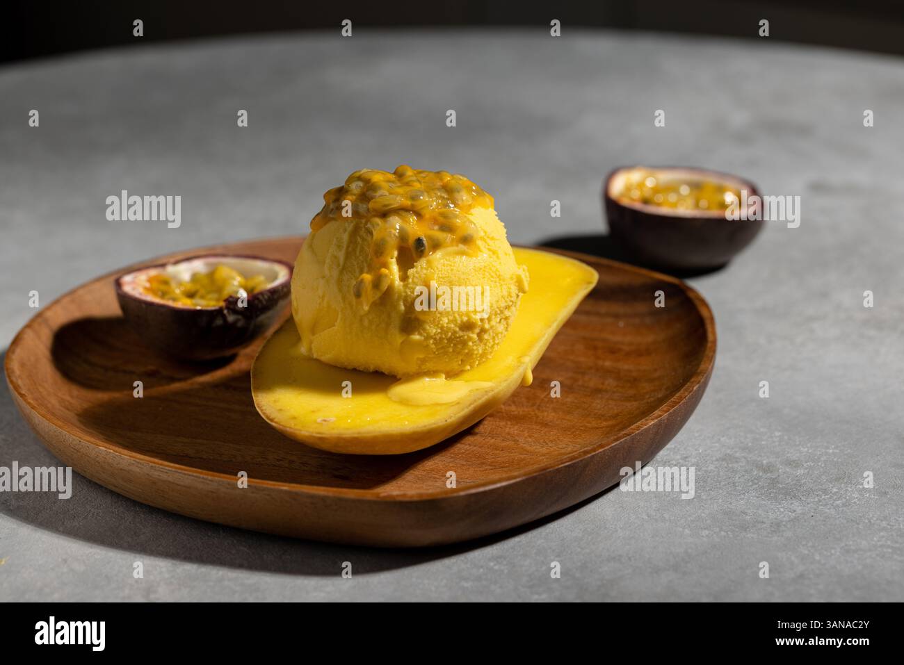 Mango and passion fruit ice cream ball Stock Photo - Alamy