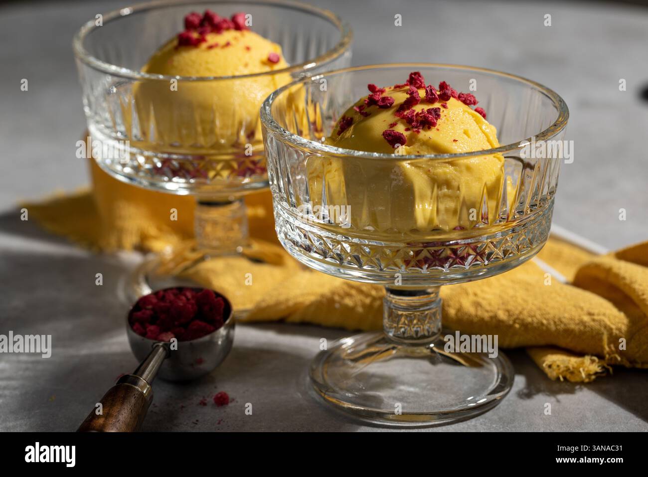 Mango and passion fruit ice cream ball Stock Photo - Alamy