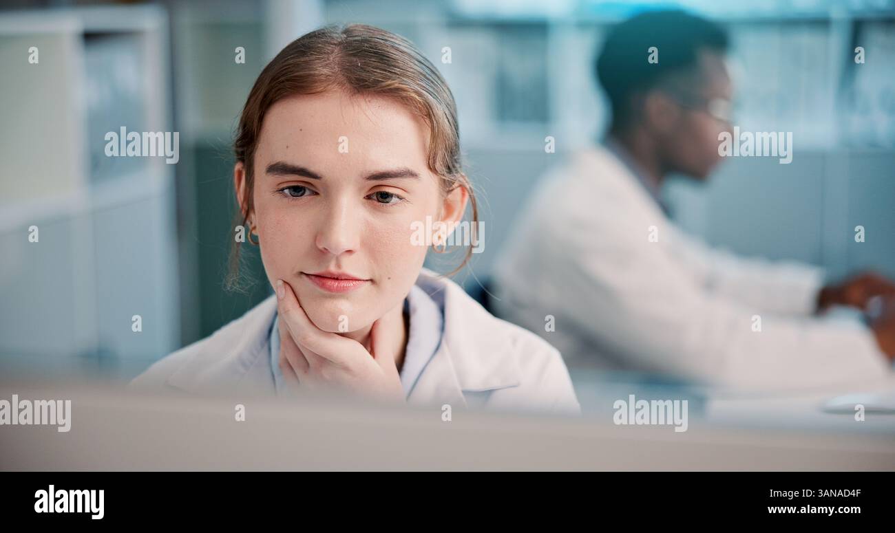Thinking, woman and scientist on computer in lab for planning, medical study and solution of ...