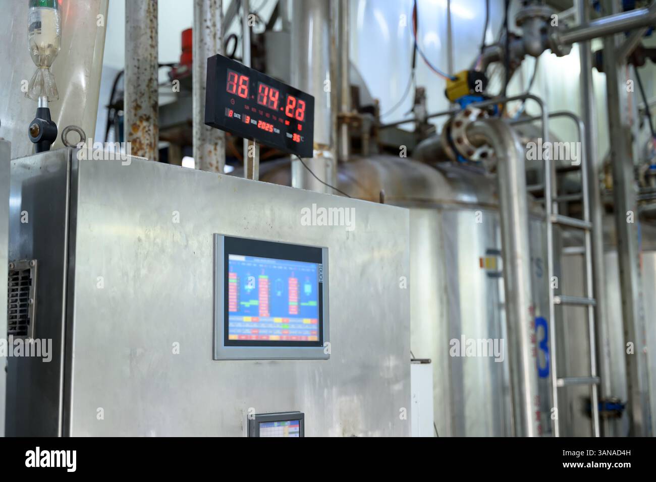 An industrial control panel with digital displays and monitoring ...