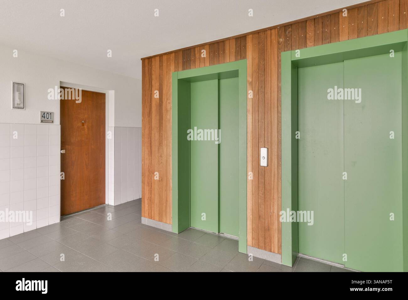 The image showcases a modern elevator setup with green doors, wooden panels, and a bright ...