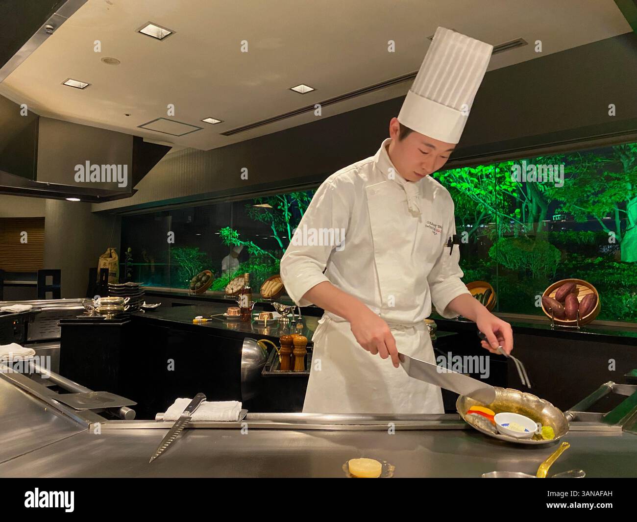 Teppanyaki Chef cooking at the Minami restaurant on the 10th floor of ...
