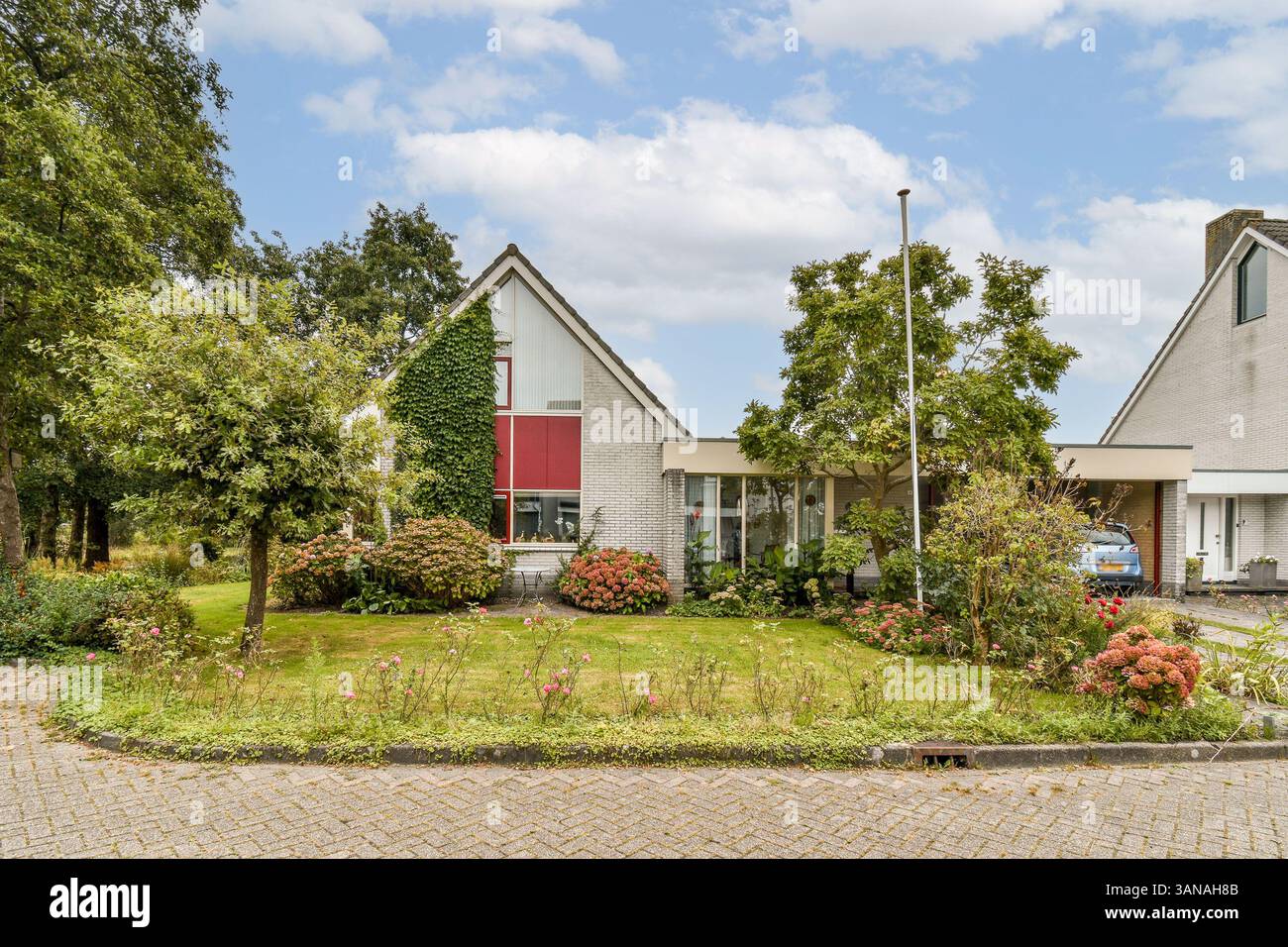 A contemporary home featuring a unique architectural design, set ...