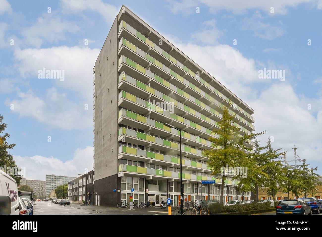 A striking modern building showcasing a unique angled design with green ...