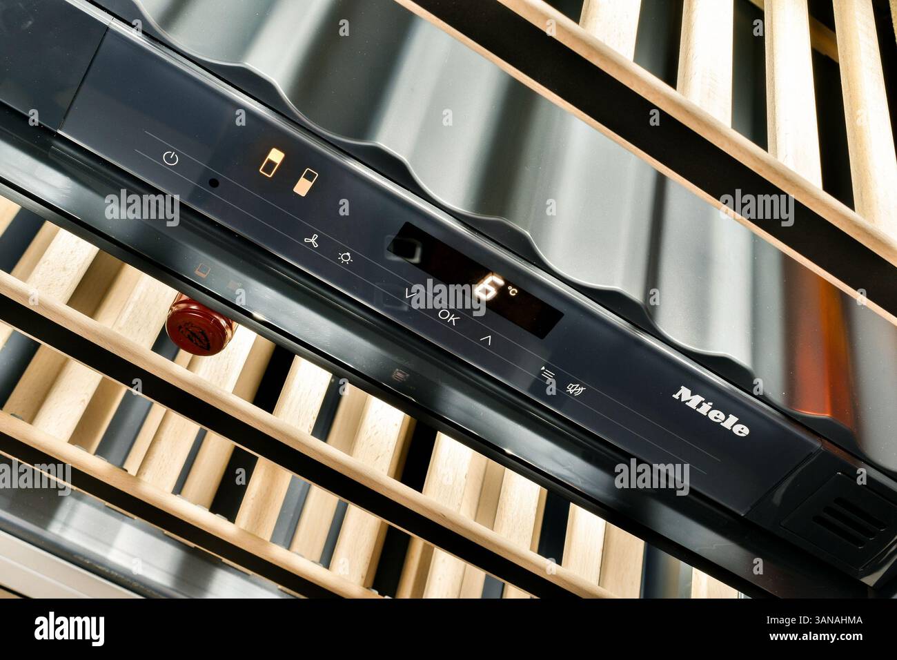 A close-up view of a modern kitchen appliance control panel featuring ...