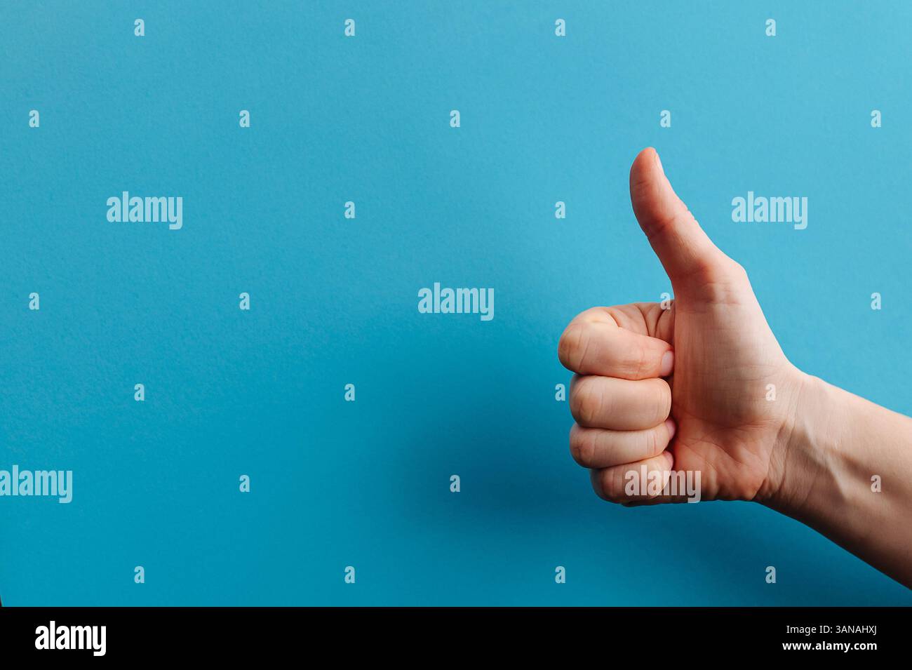 thumbs up hand sign. woman hand showing thumb up, like, okay, approval ...