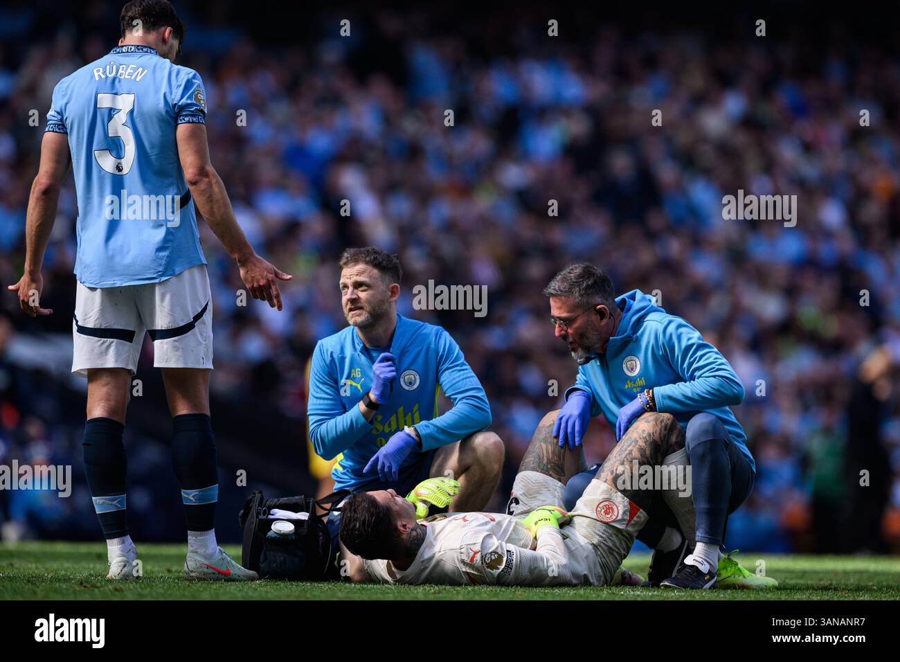 MANCHESTER, ENGLAND - APRIL 12: injured goalkeeper Ederson during the ...