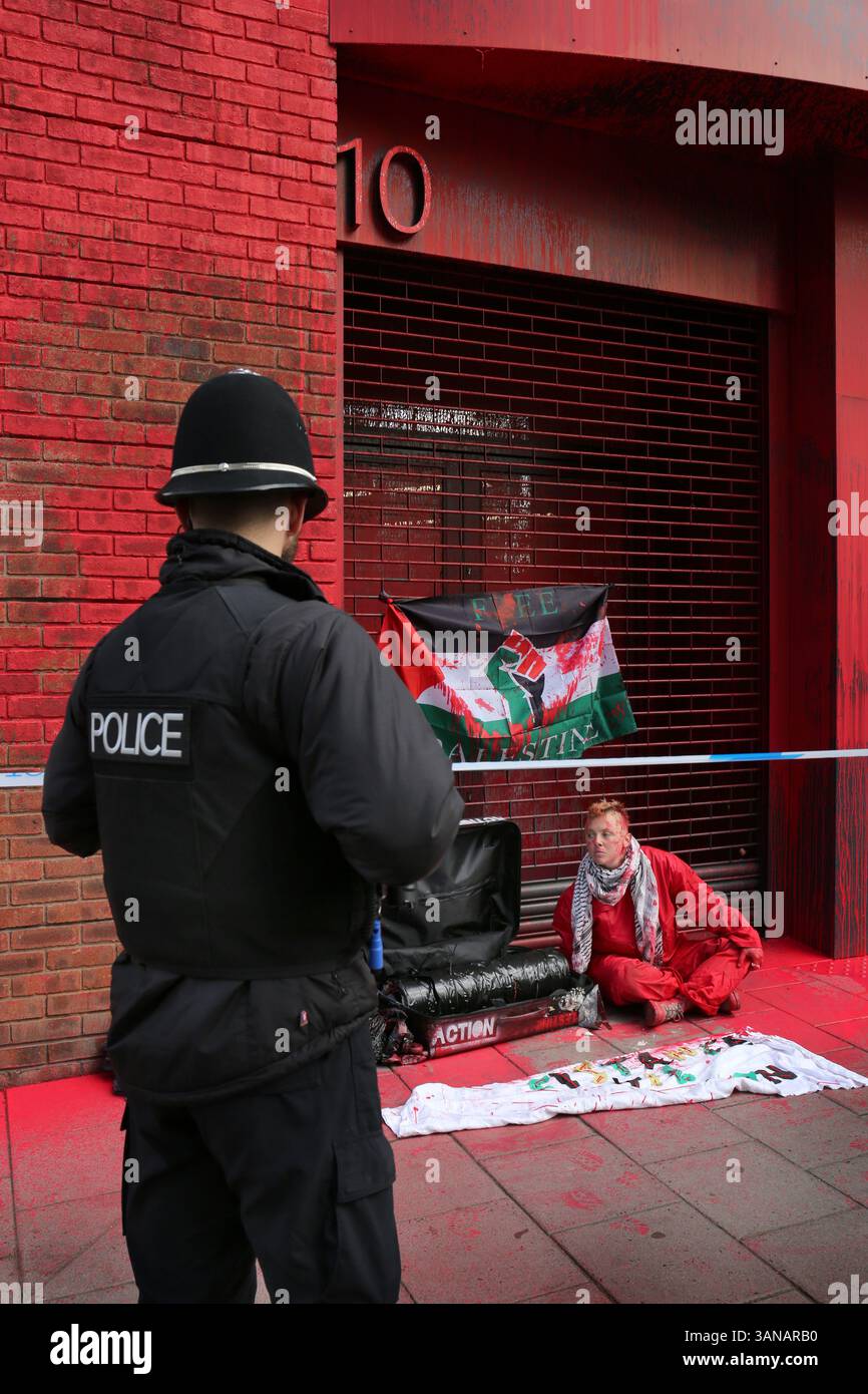 Bristol, England, UK. 14th Apr, 2025. A single activist sits on the ...