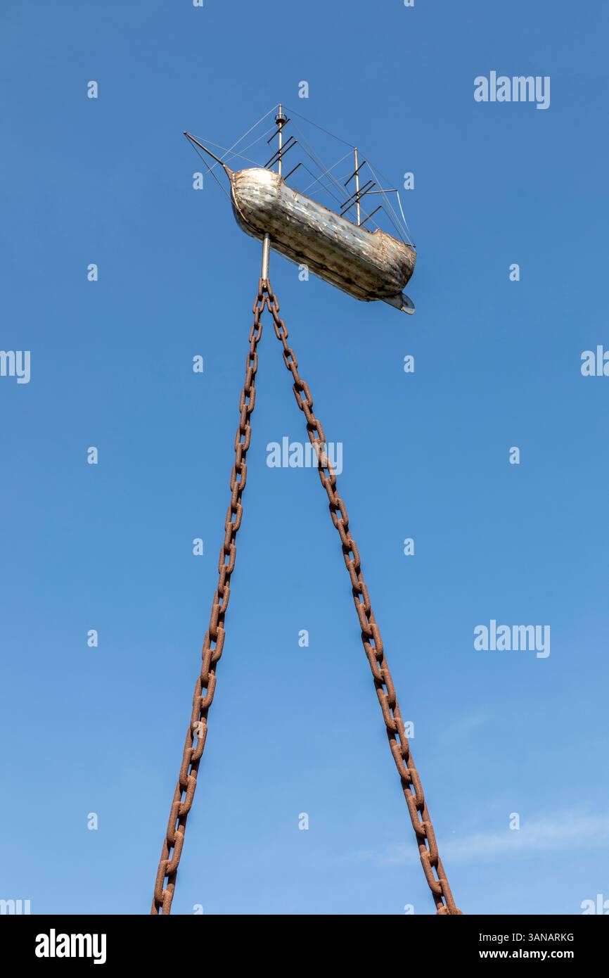 An art installation of a floating sailing ship on a welded chain Stock ...