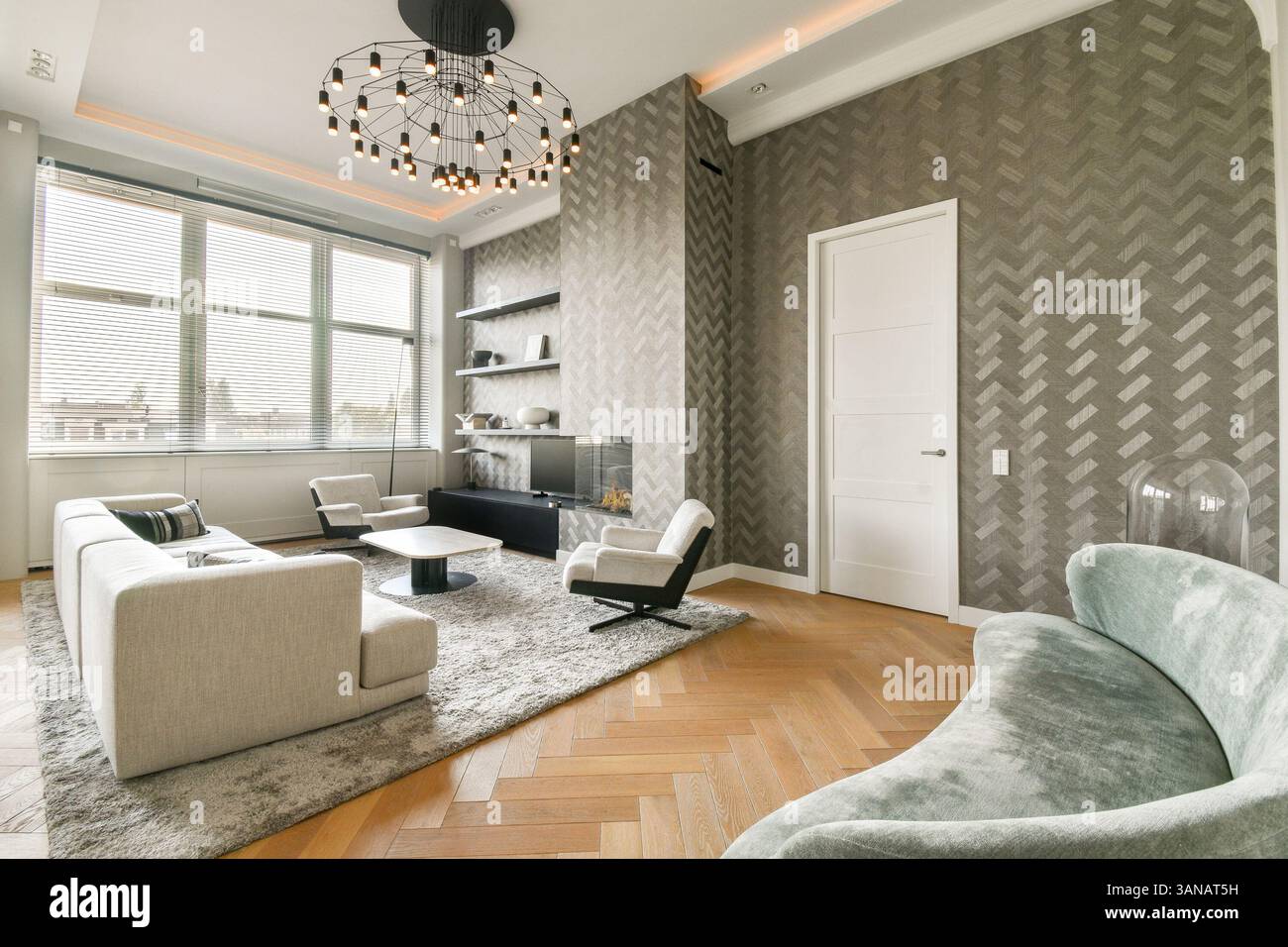 A spacious and stylish living room featuring sleek furniture ...