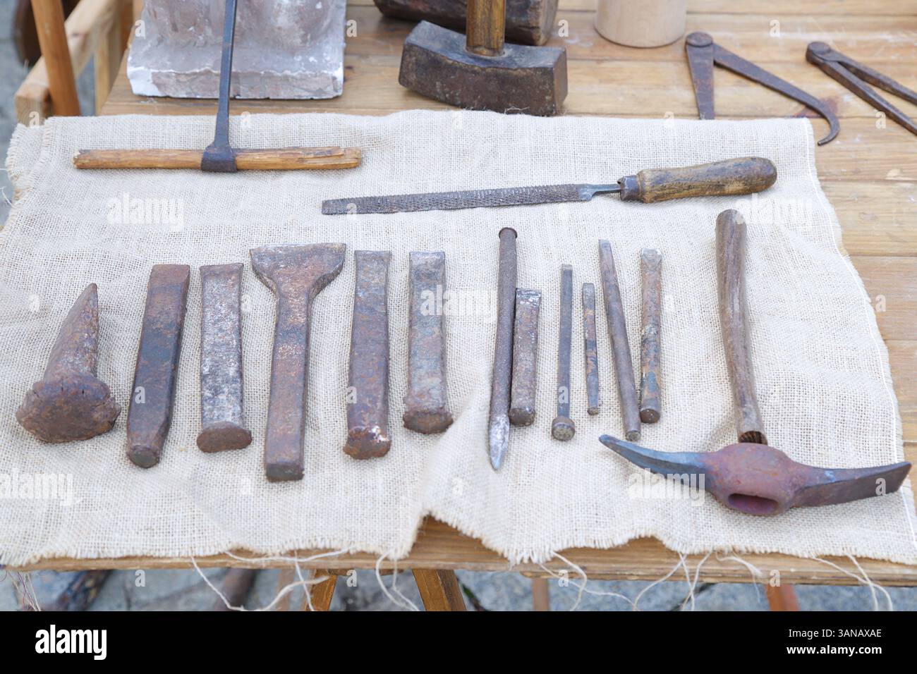 Wood and stone artisan tools exhibited in a medieval market Stock Photo ...