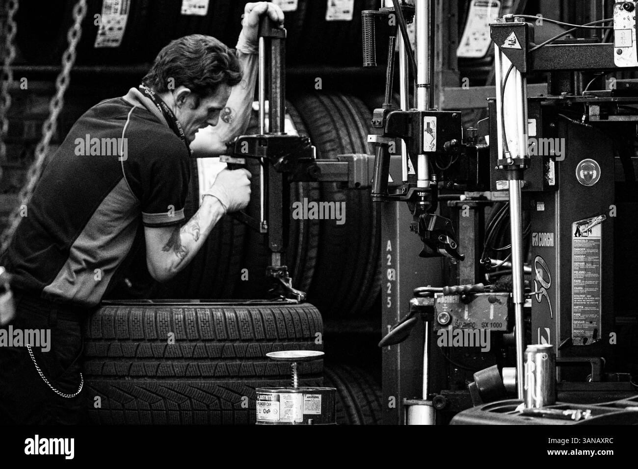 Tyre removal Black and White Stock Photos & Images - Alamy