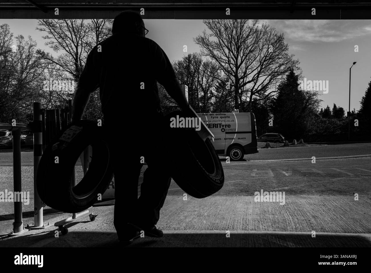 Tyre fitter Black and White Stock Photos & Images - Alamy
