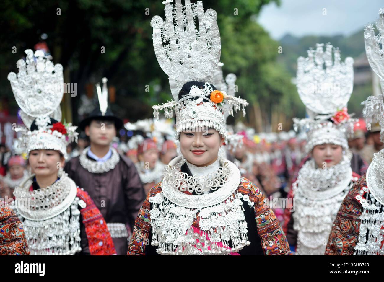 People of Miao ethnic group attend a parade to celebrate the Miao ...
