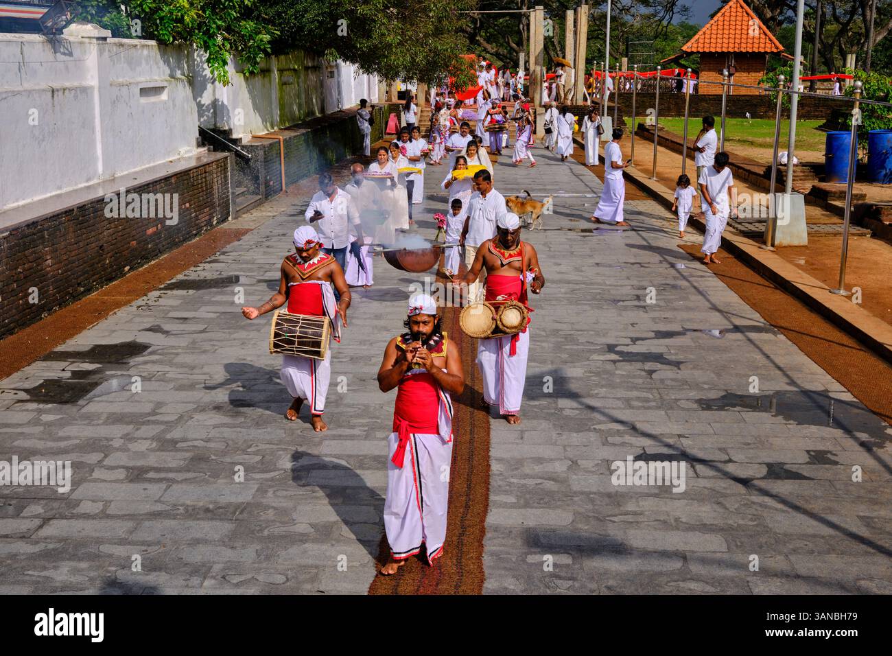 Sri Lanka, North Central Province, Anuradhapura, Ruvanvelisaya Dagoba, pilgrim procession with ...