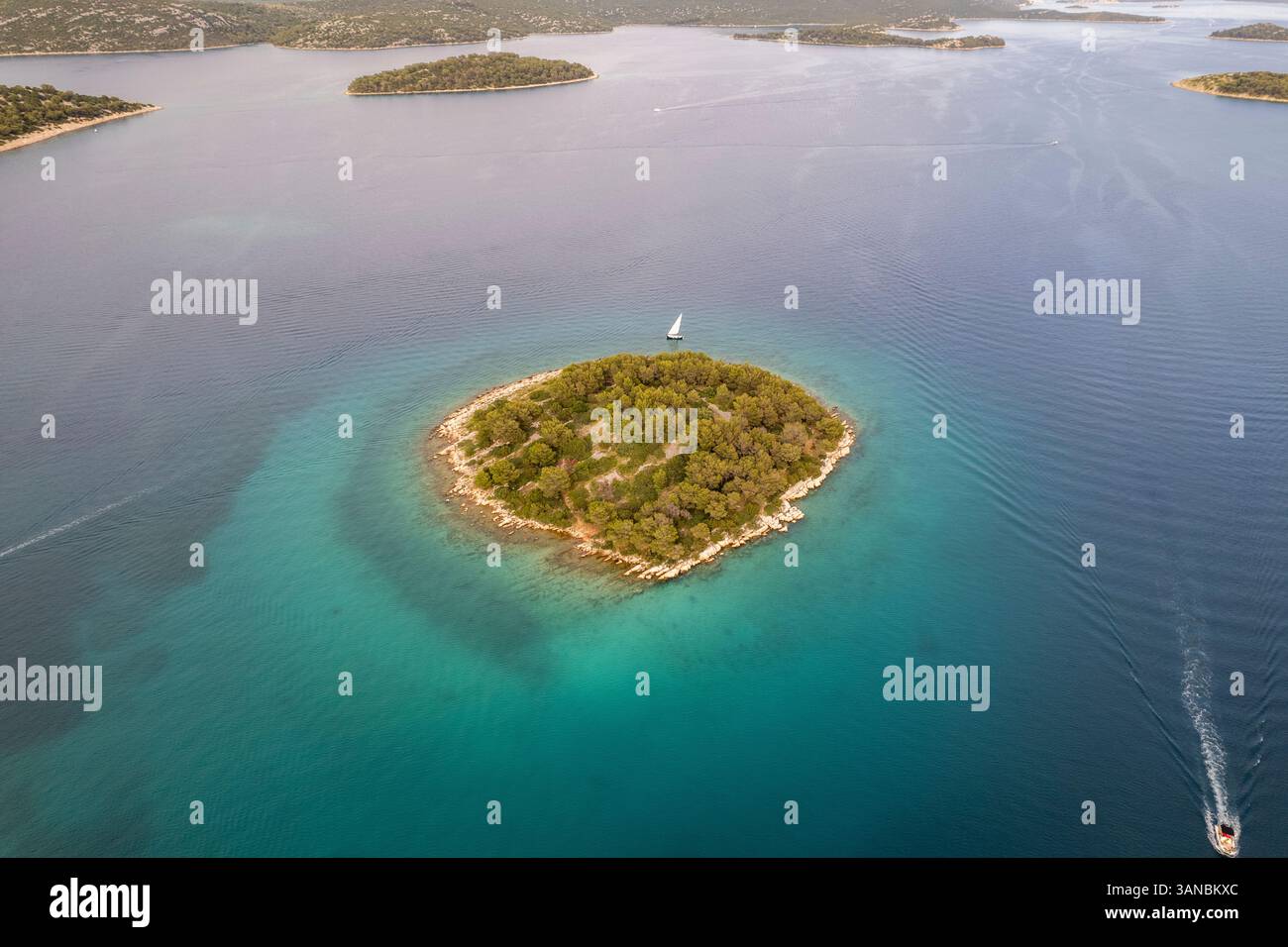 Aerial view of Murtur Island with sailing boats in the turquoise ...