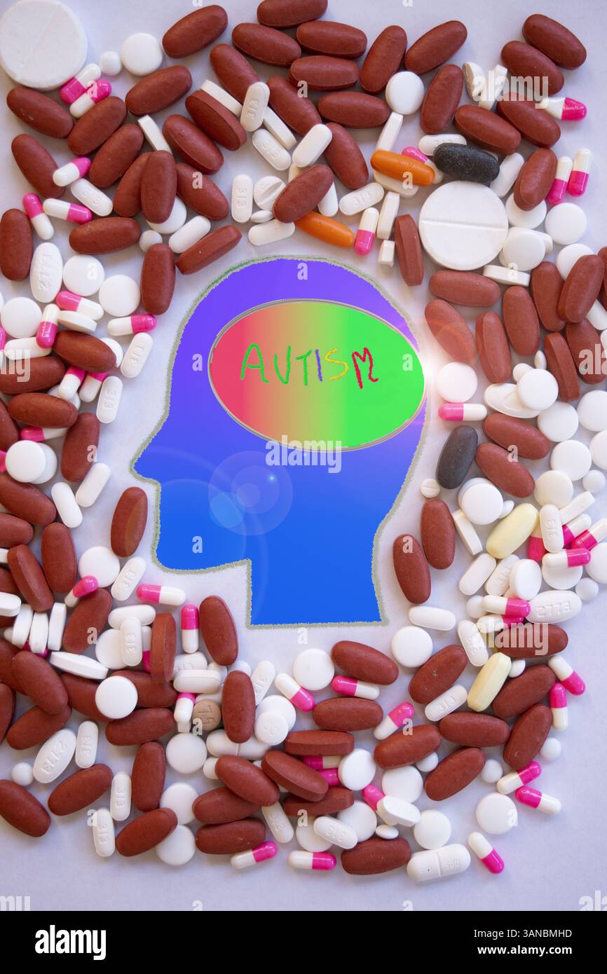 autism concept with the shape of a head surrounded by pills Stock Photo ...
