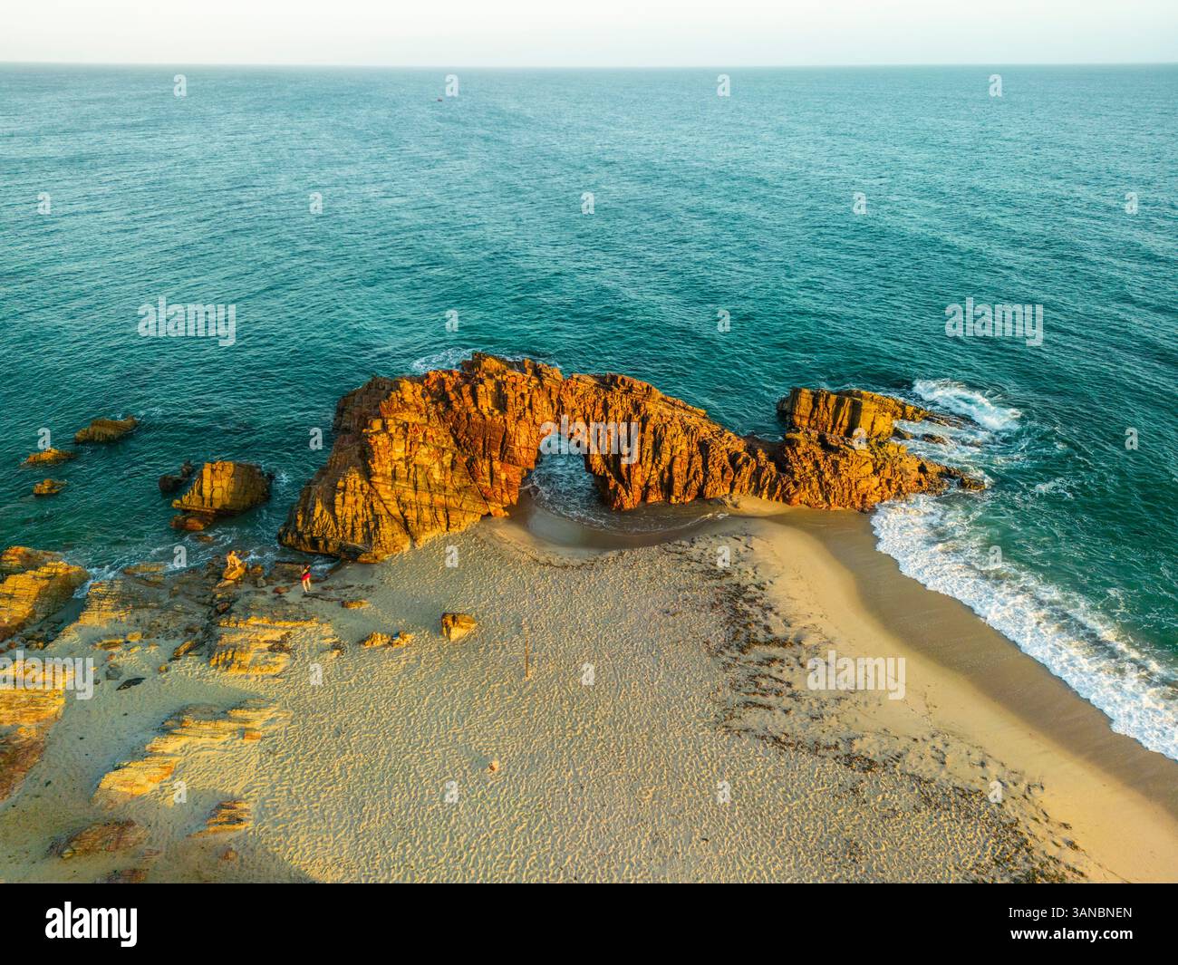 Aerial view of a natural arch along the coast in Jericoacoara, State of ...
