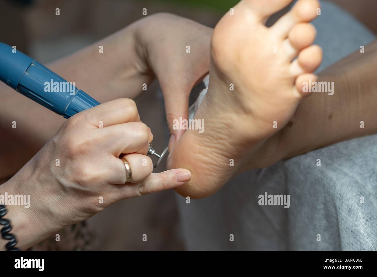 Modern peeling machine for feet. Skin care gadget for dry heels and ...