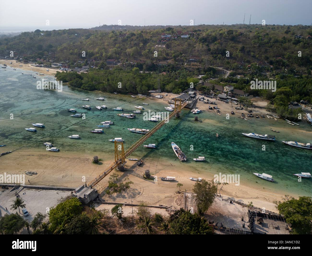 Aerial view of the yellow bridge connecting to sandy beach and ...