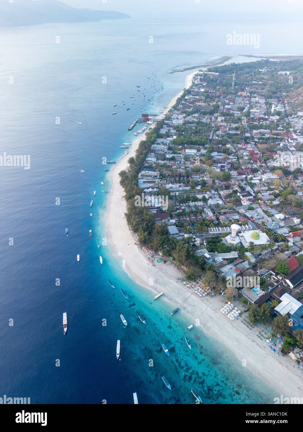 Aerial view of tropical island with turquoise water and boats in the ...