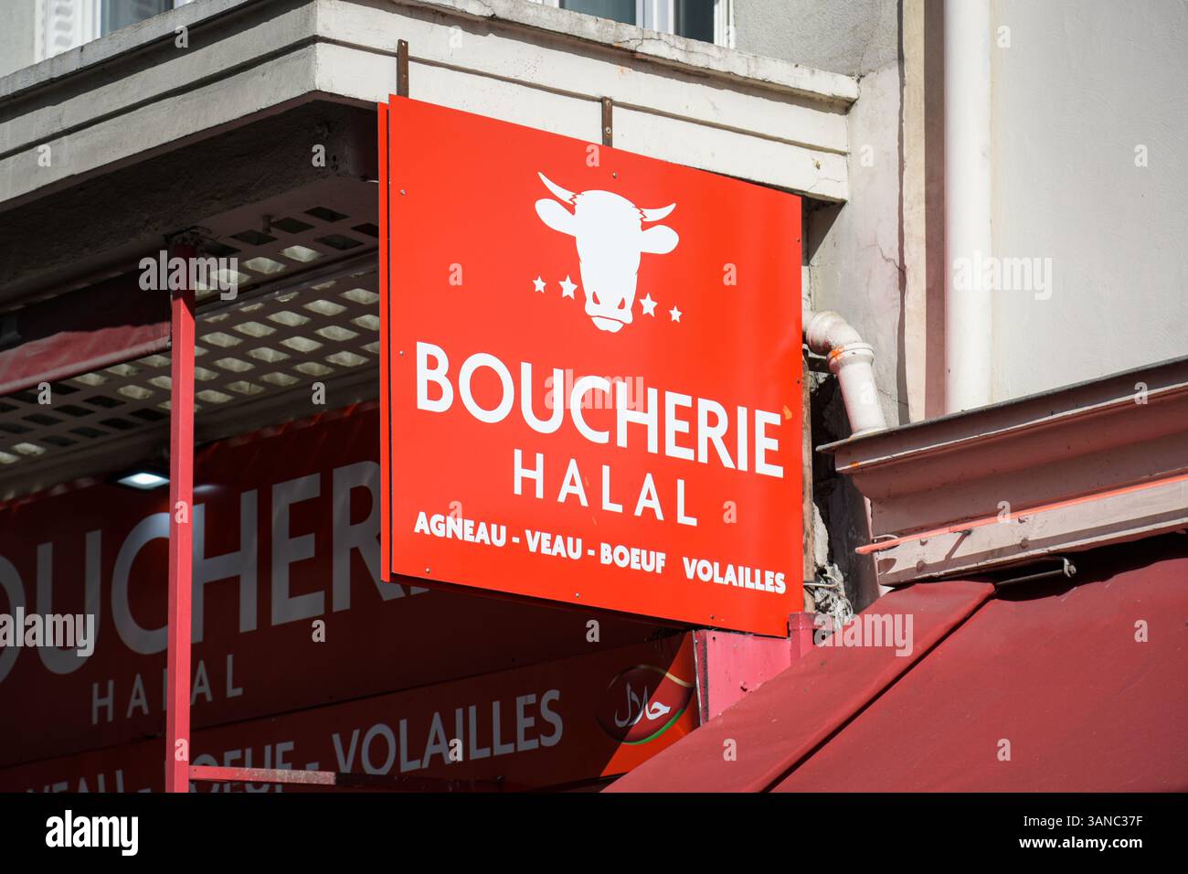 view of the sign of a halal butcher shop in Paris Stock Photo - Alamy