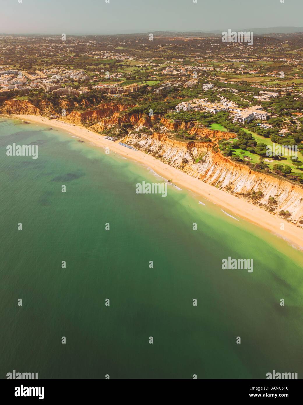Aerial view of beautiful Praia de Falesia beach with scenic cliffs and ...