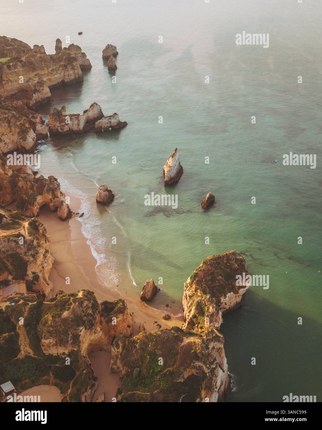 Aerial view of beautiful Praia dos Tres Irmaos beach with scenic cliffs ...
